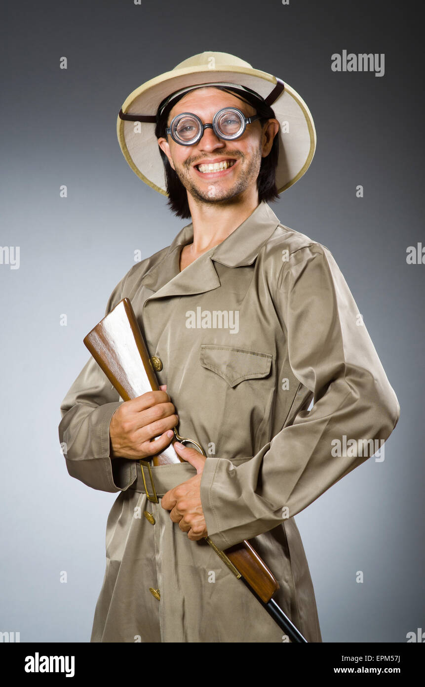 Funny safari hunter with rifle Stock Photo - Alamy