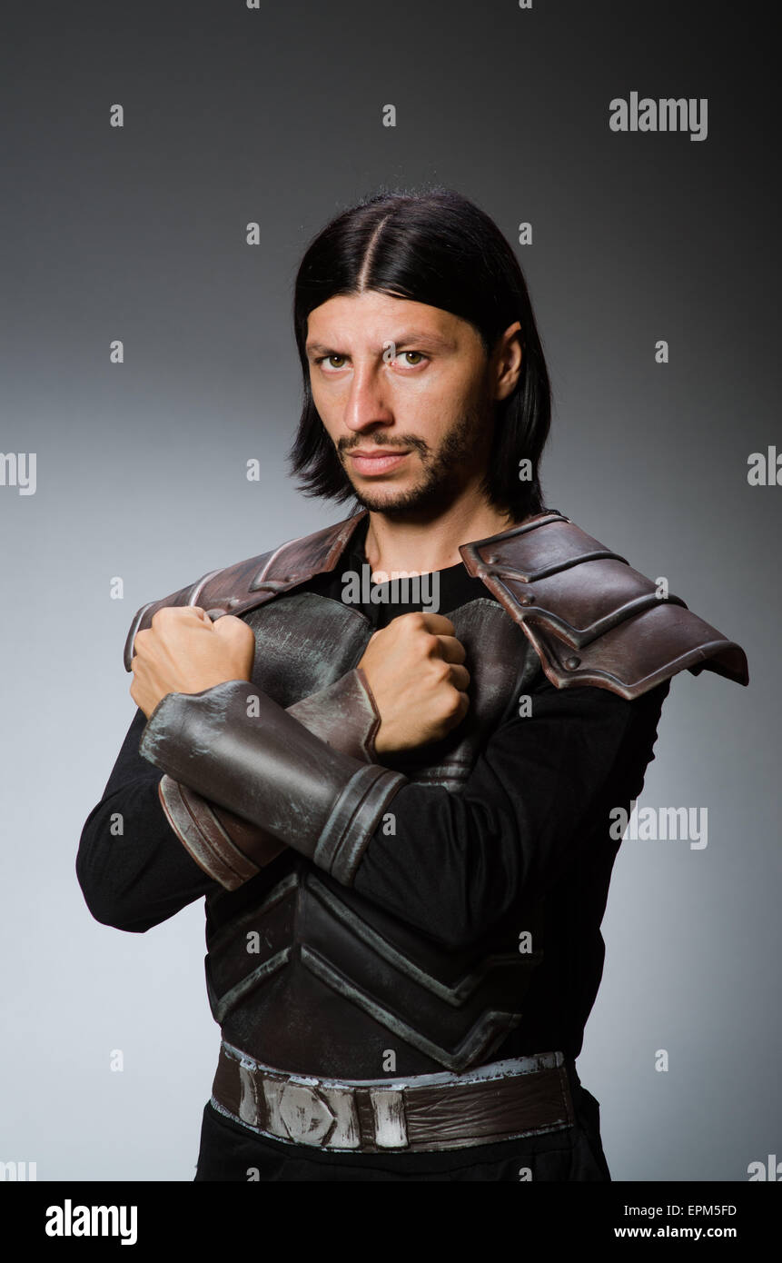 Angry warrior against dark background Stock Photo - Alamy