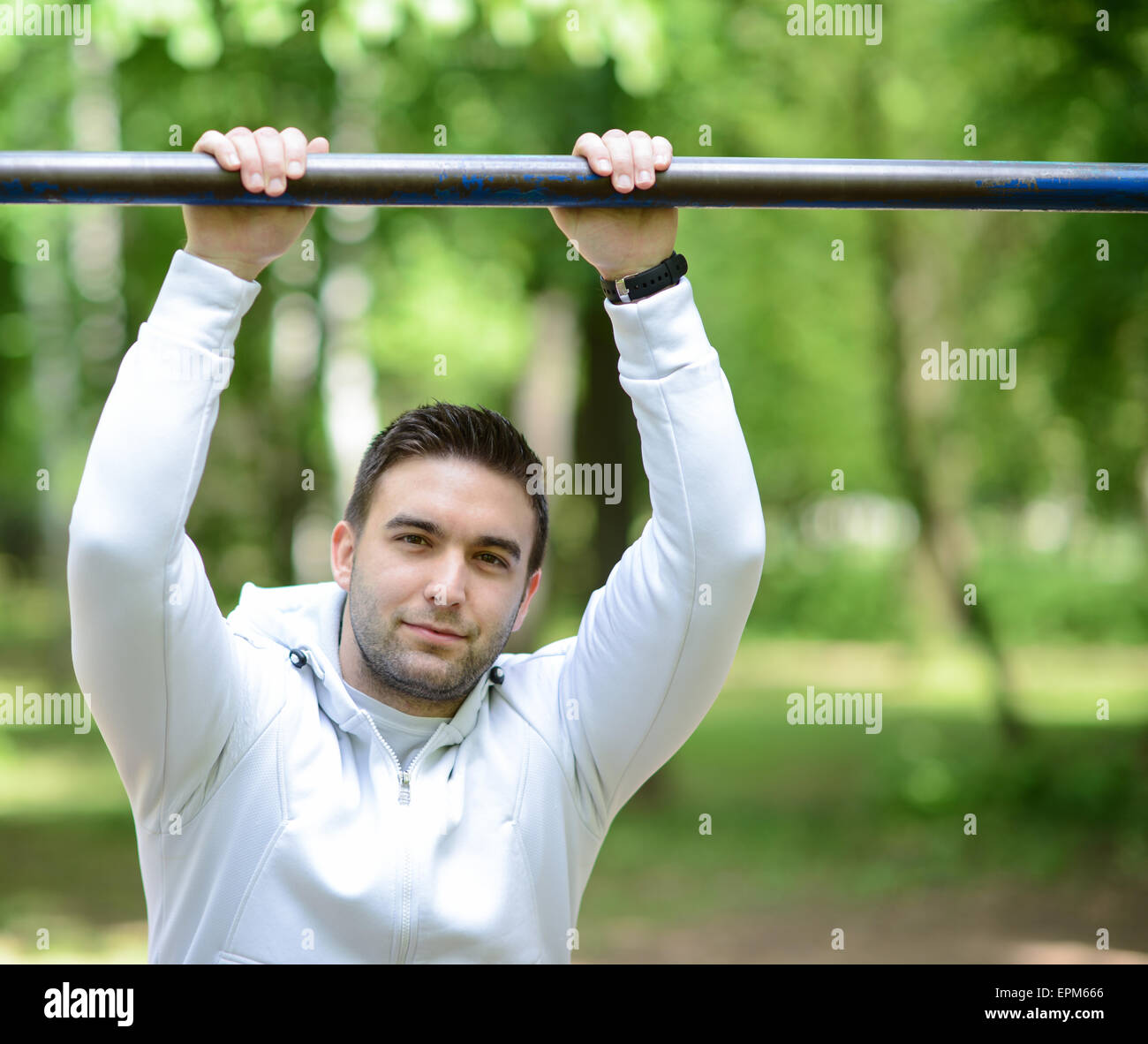Portrait of handsome young sportsman in park Stock Photo - Alamy