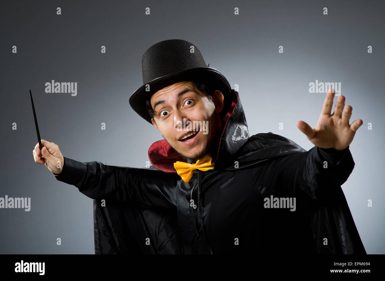Funny magician man with wand and hat Stock Photo - Alamy