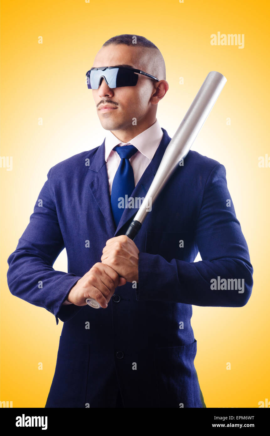 Handsome businessman with bat on white Stock Photo - Alamy