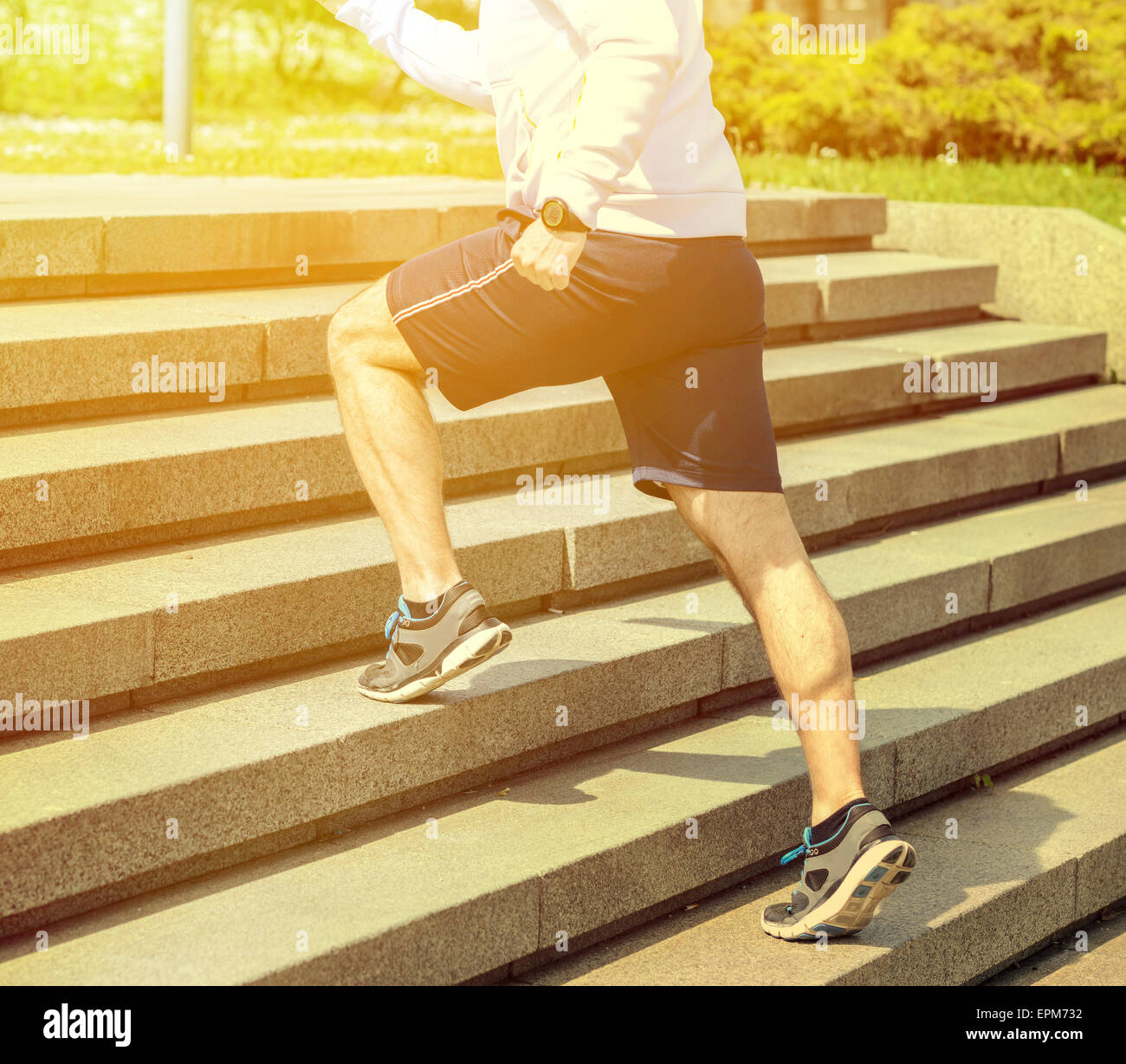 Practice - Close up of young man running up the stairs Stock Photo - Alamy