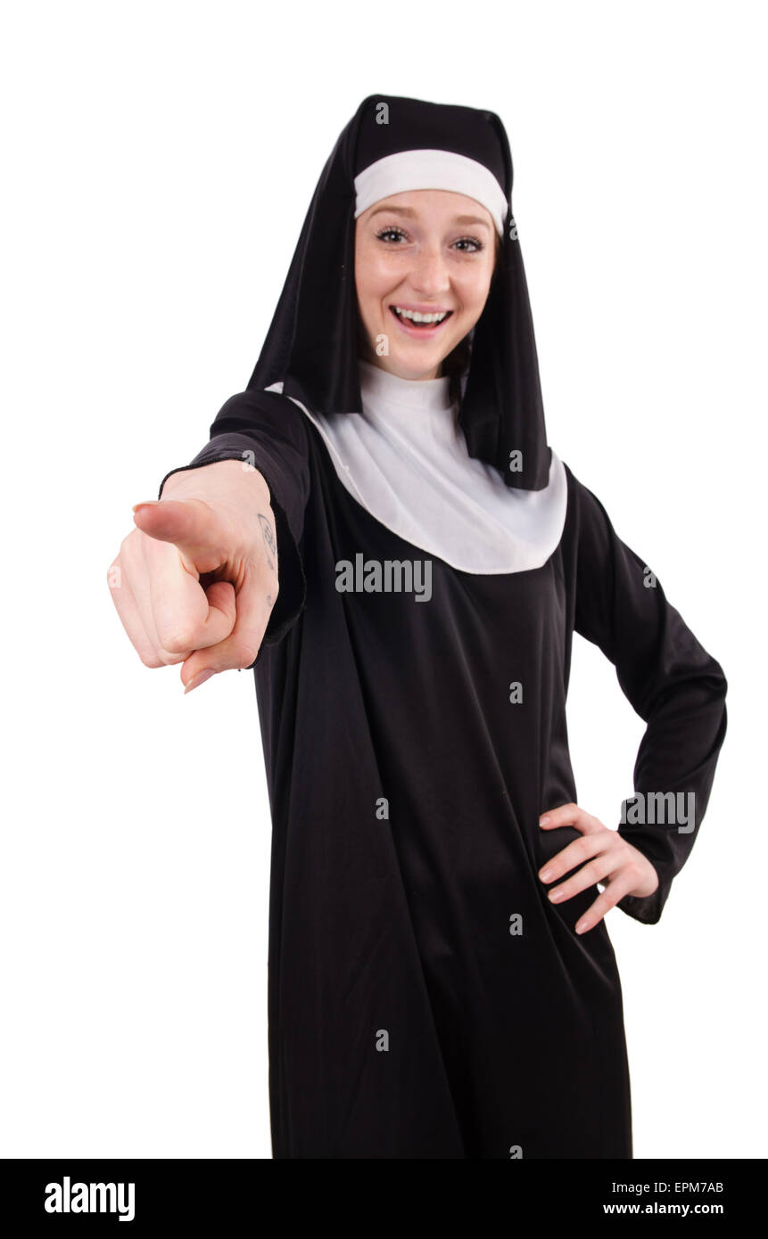 Young smiling nun pointing isolated on white Stock Photo - Alamy