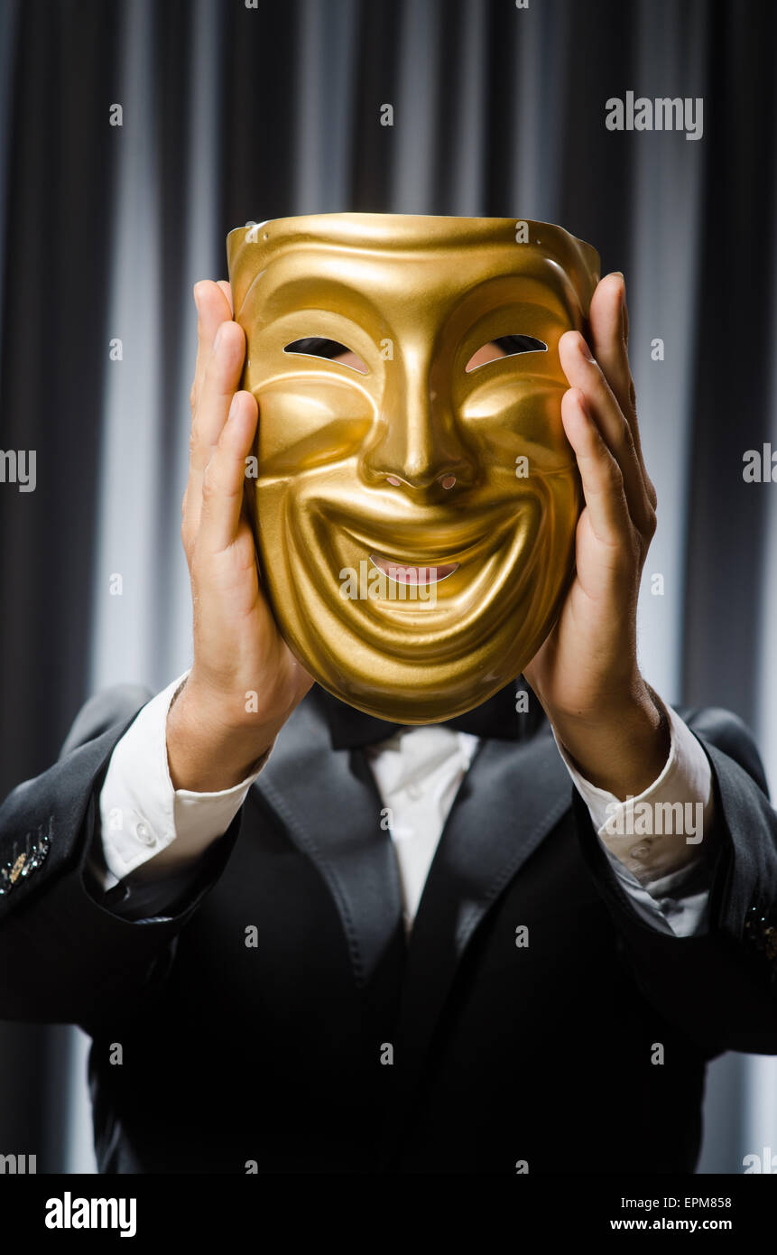 Funny concept with theatrical mask Stock Photo - Alamy