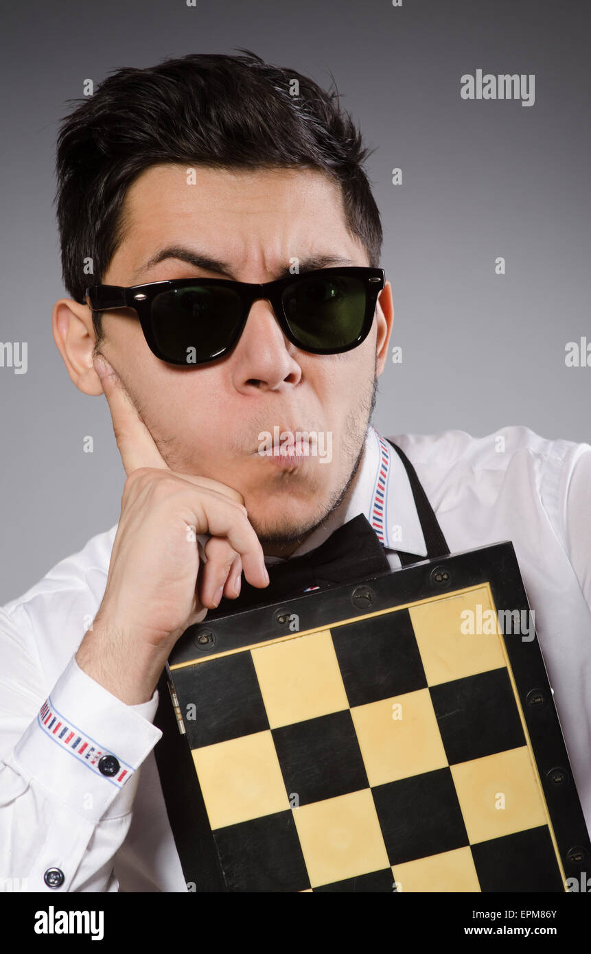 Funny chess player with board Stock Photo - Alamy