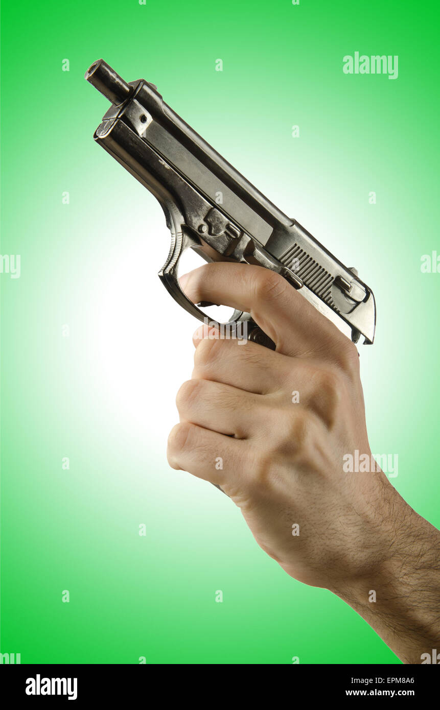 Gun in the hand on white Stock Photo - Alamy
