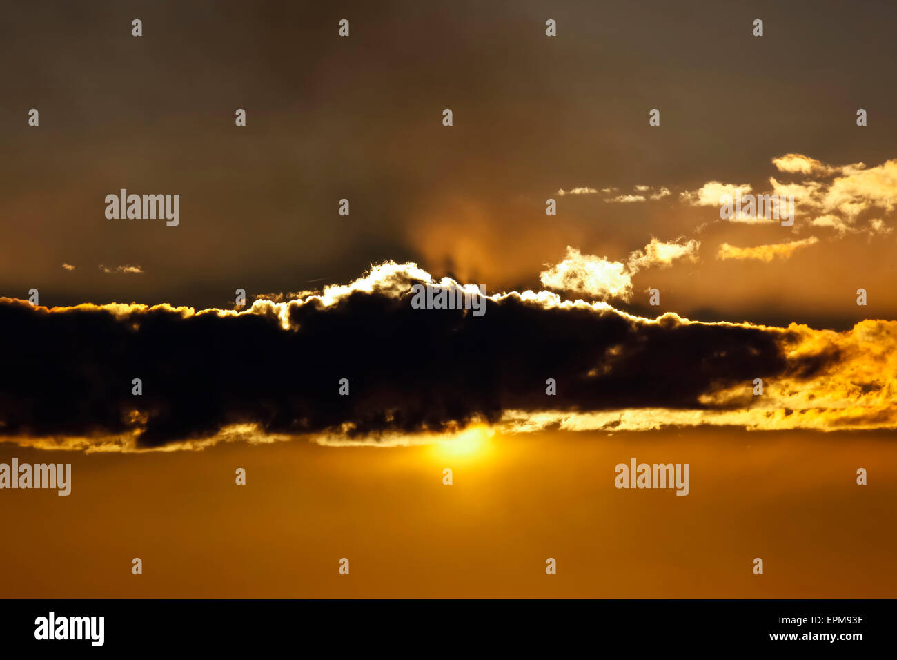 Sun hiding behind cloud Stock Photo - Alamy
