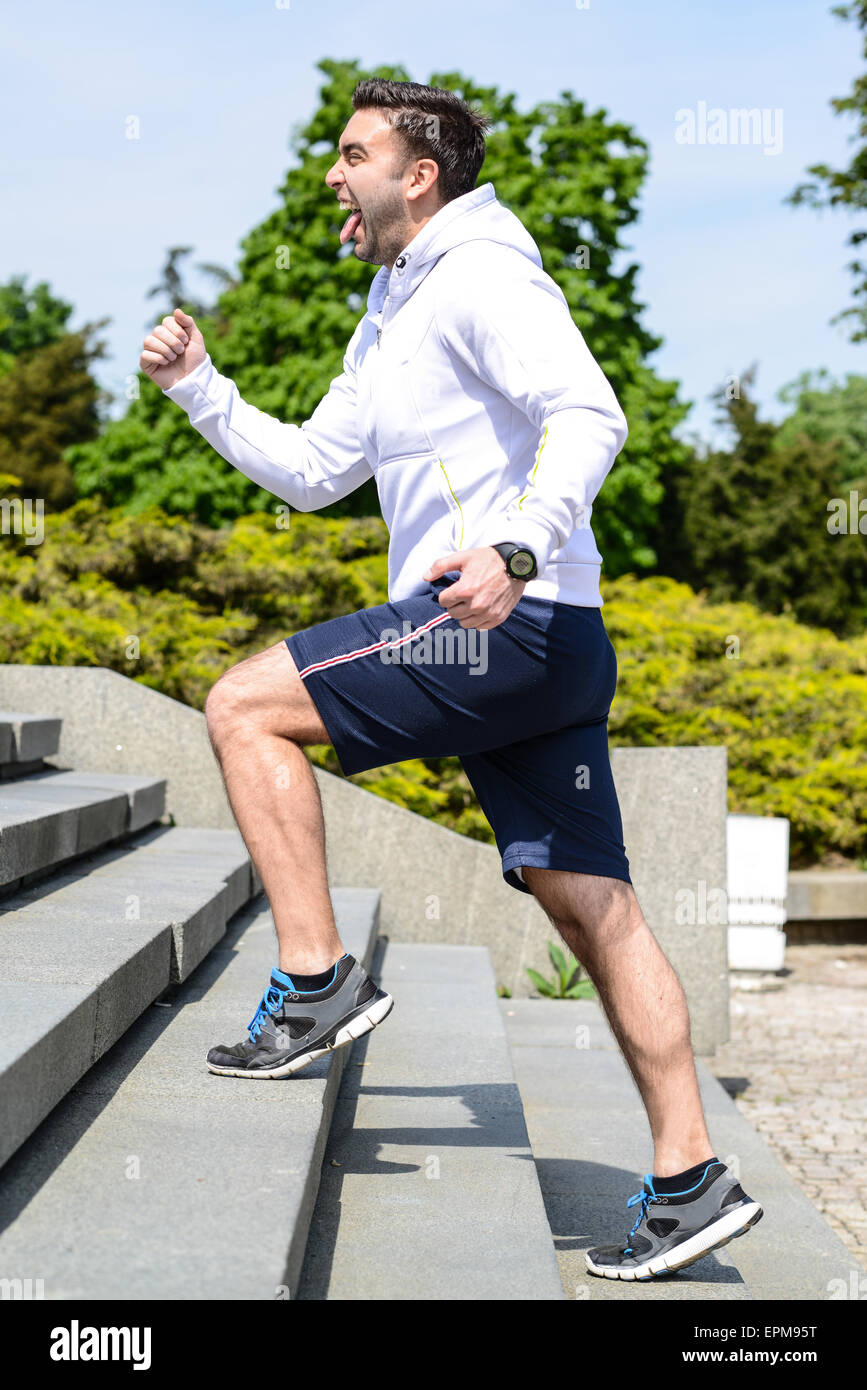 Practice - Close up of young man running up the stairs Stock Photo - Alamy