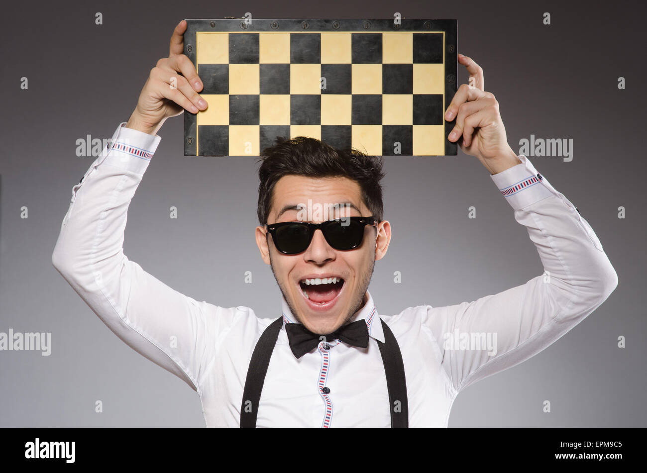 Funny chess player with board Stock Photo - Alamy