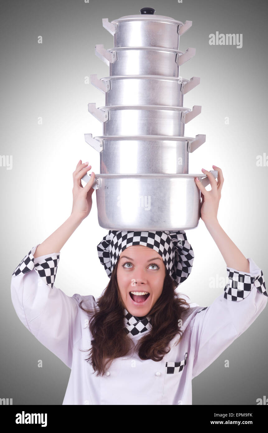Cook with stack of pots on white Stock Photo - Alamy