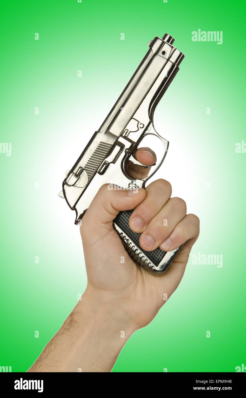 Gun in the hand on white Stock Photo - Alamy