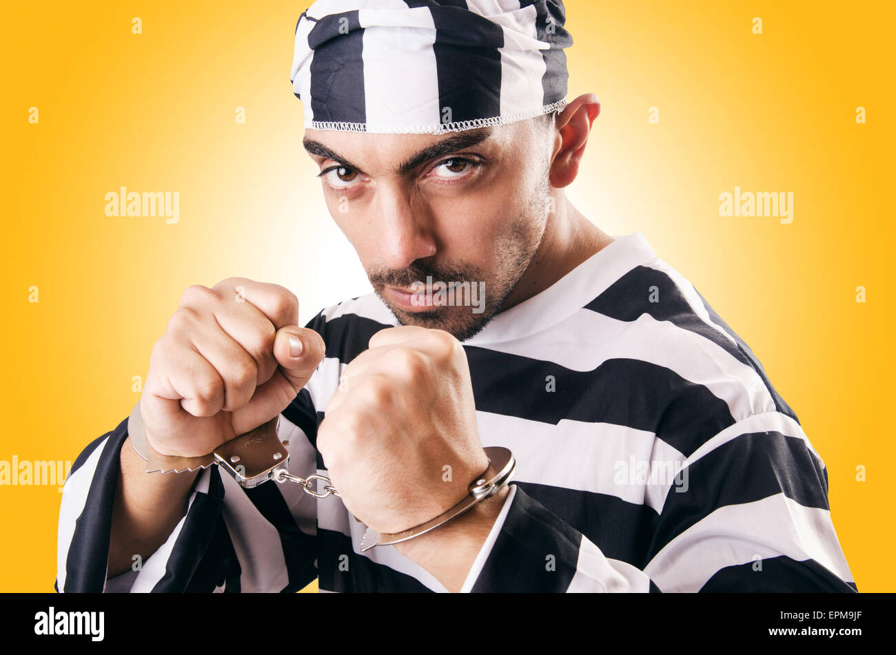 Convict criminal in striped uniform Stock Photo - Alamy