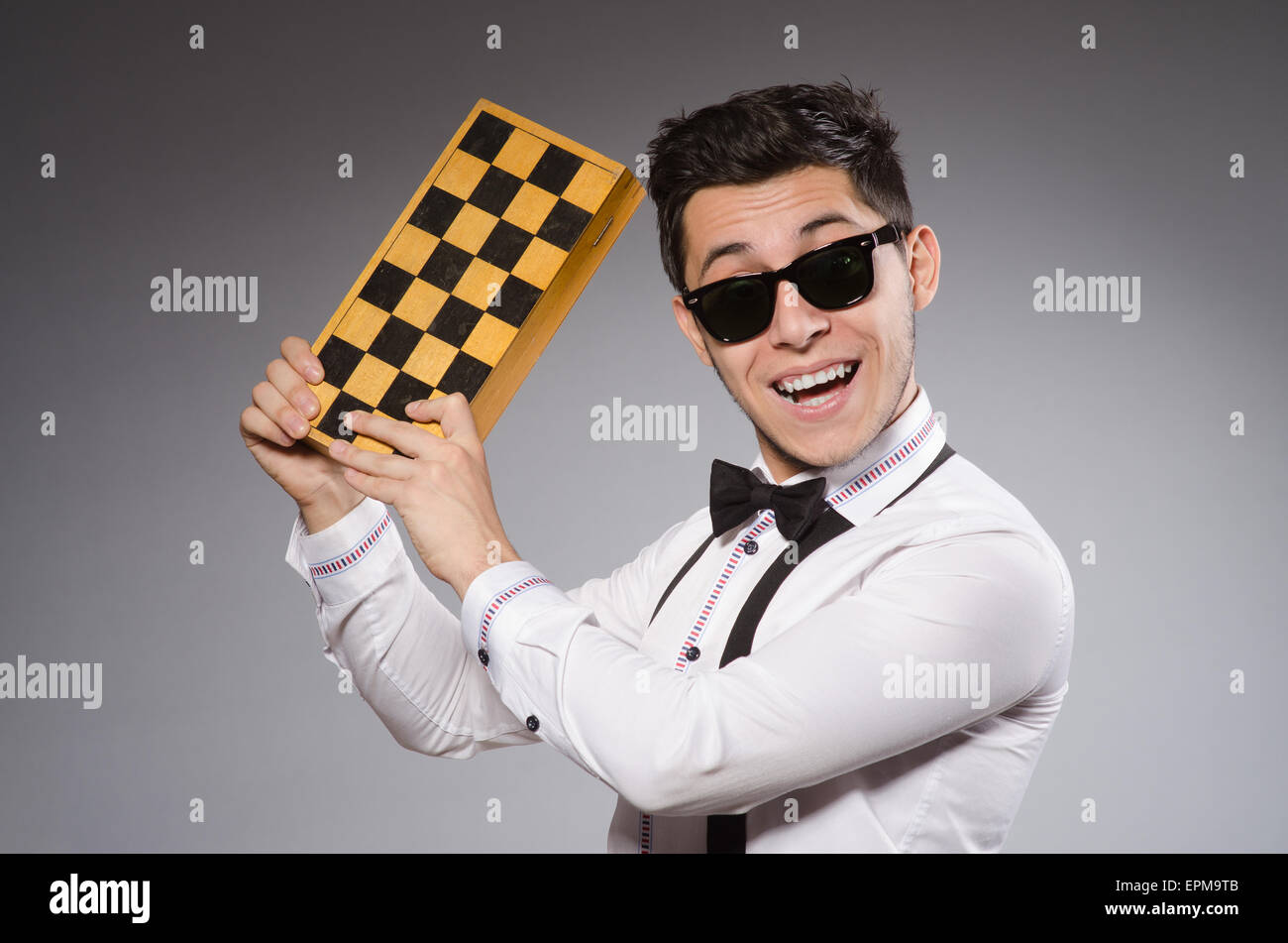 Funny chess player with board Stock Photo - Alamy