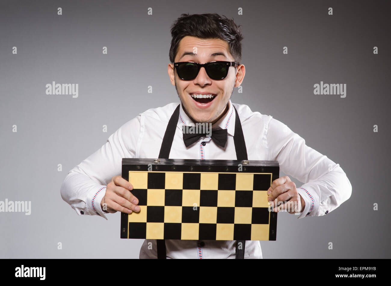 Funny chess player with board Stock Photo - Alamy