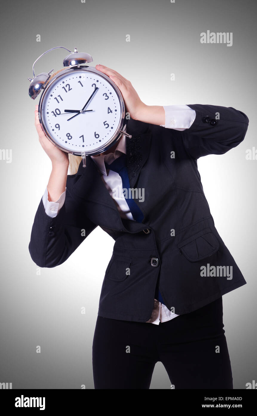 Woman with giant clock on white Stock Photo - Alamy