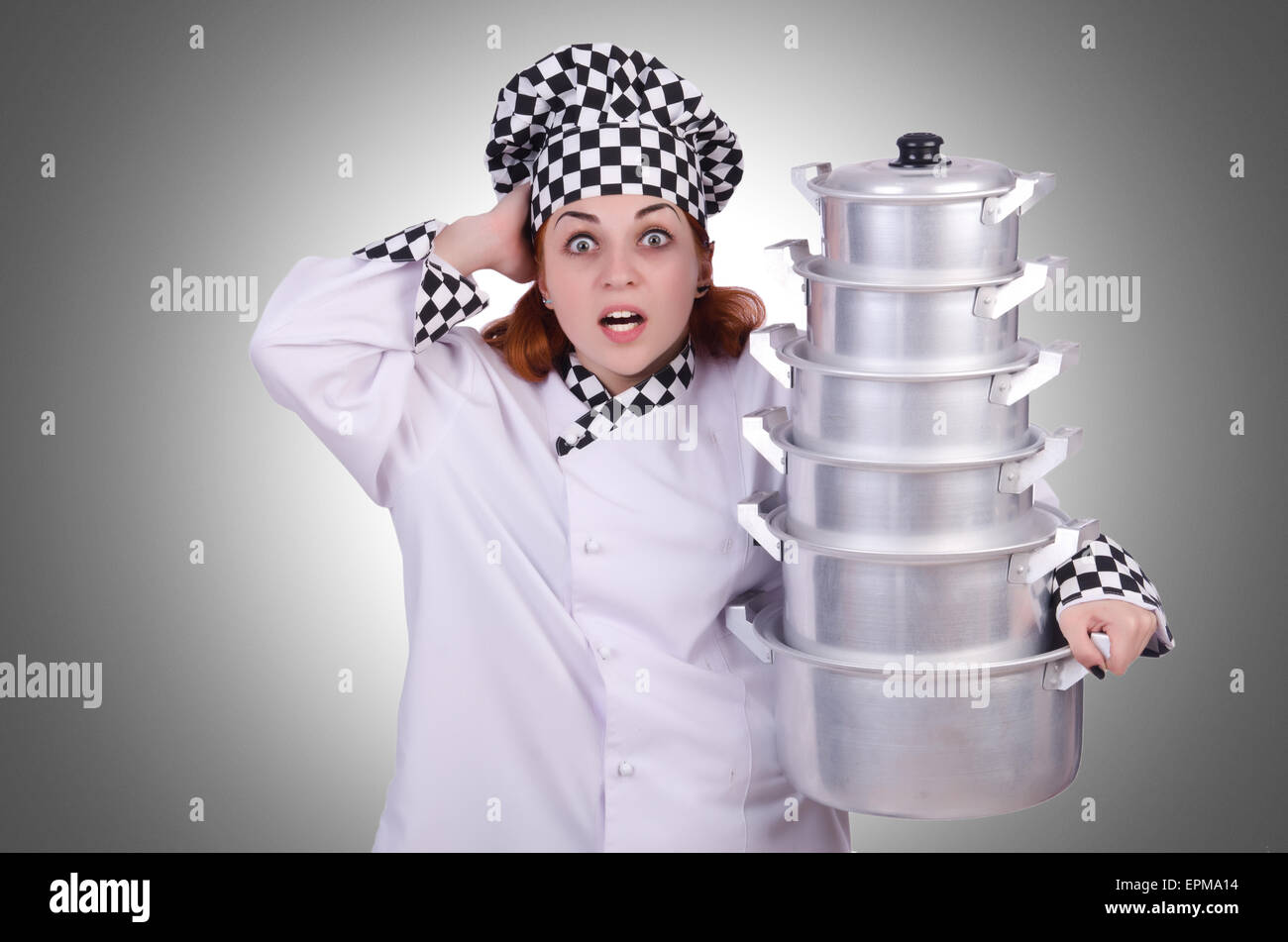 Cook with stack of pots on white Stock Photo - Alamy