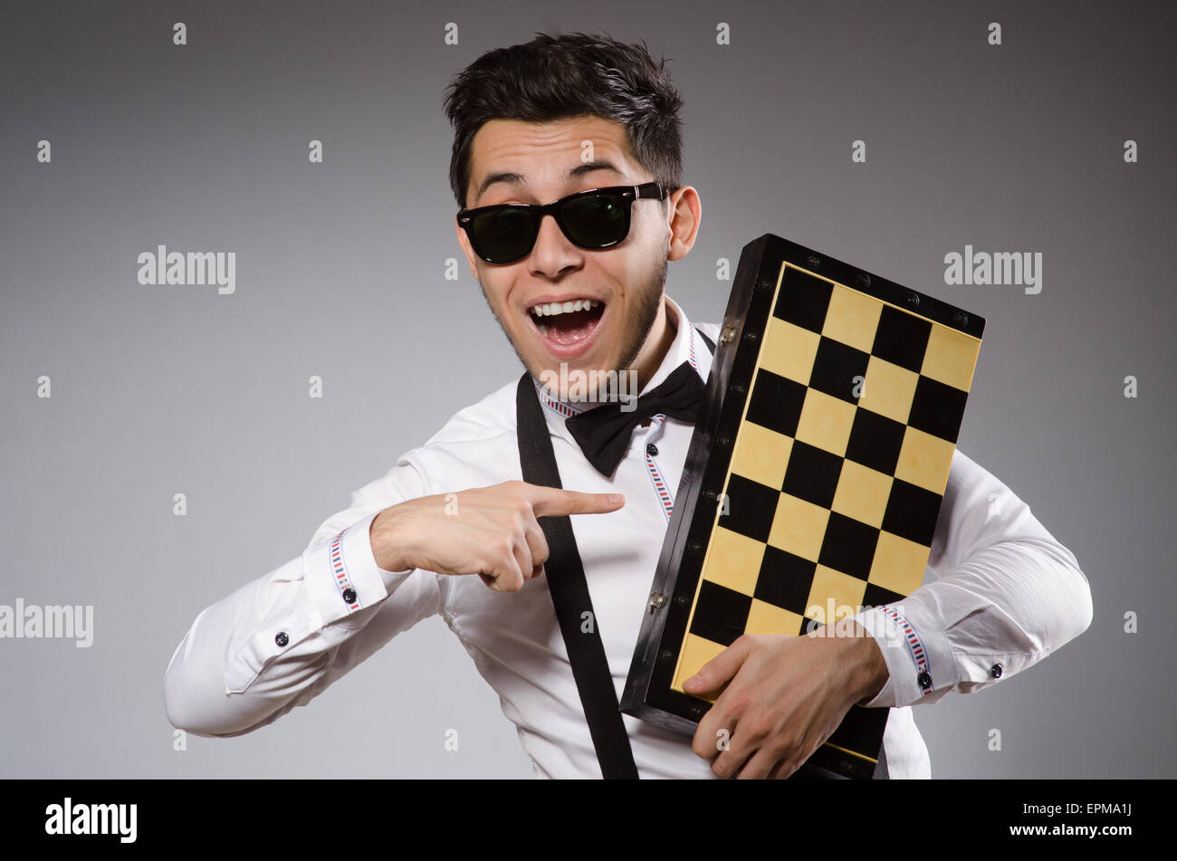 Funny chess player with board Stock Photo - Alamy