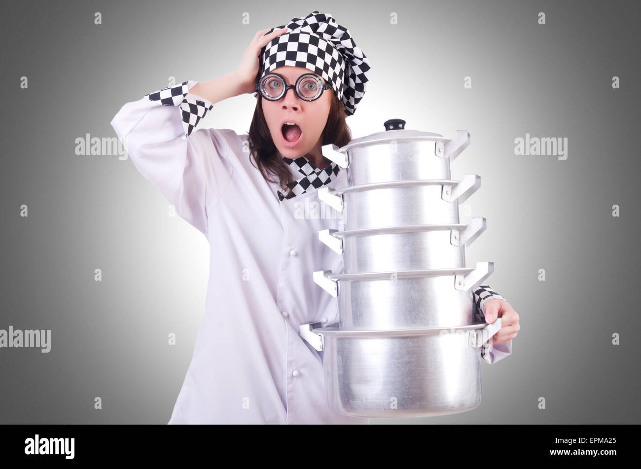 Cook with stack of pots on white Stock Photo - Alamy