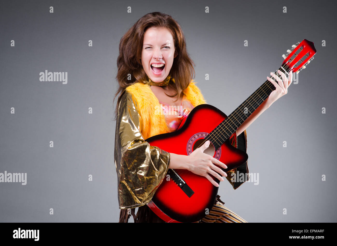 Guitar player with red instrument Stock Photo - Alamy