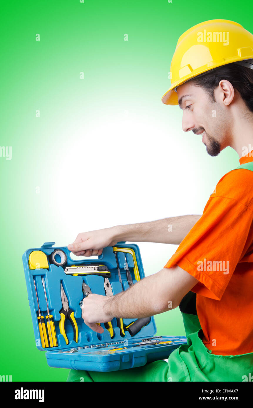 Repairman in coveralls in industrial concept Stock Photo - Alamy