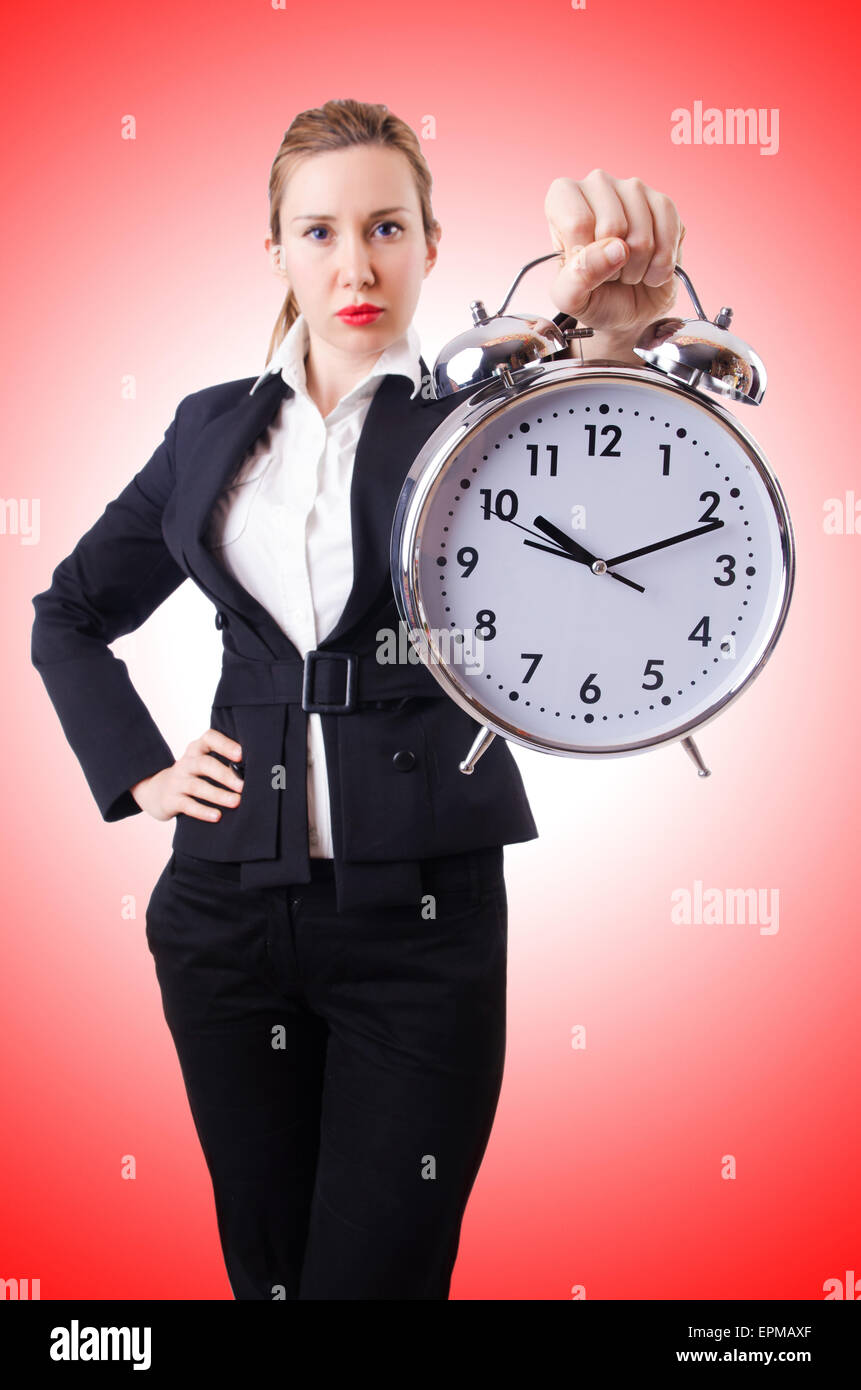 Woman businesswoman with giant clock Stock Photo - Alamy