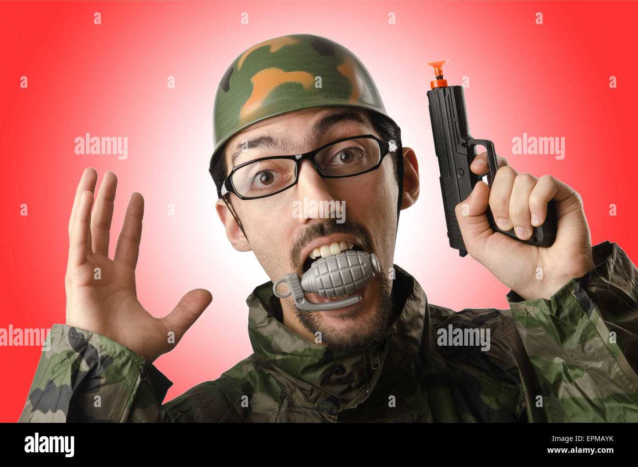 Funny soldier in humour concept Stock Photo - Alamy