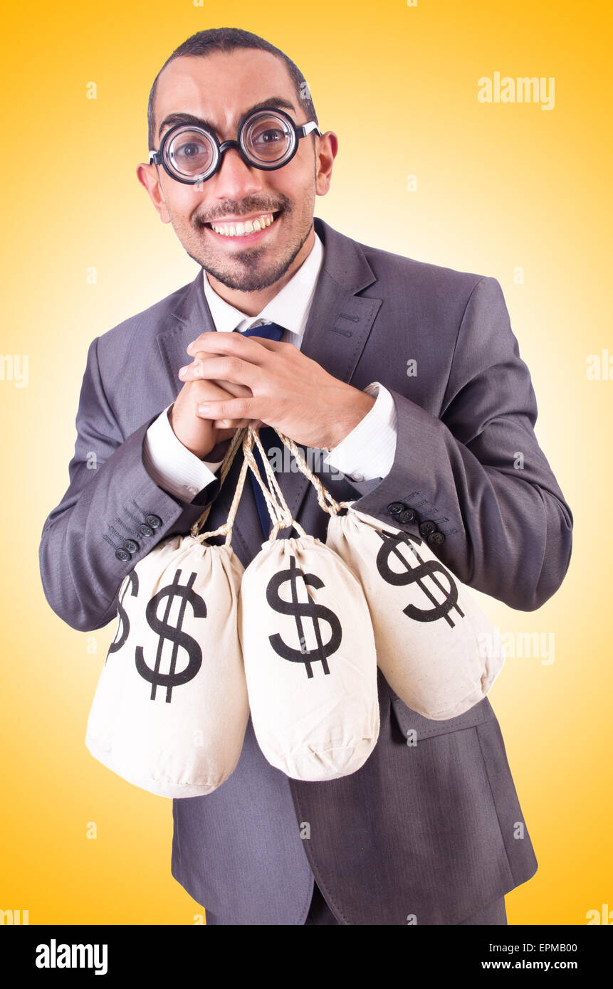 Man with sacks of money on white Stock Photo - Alamy