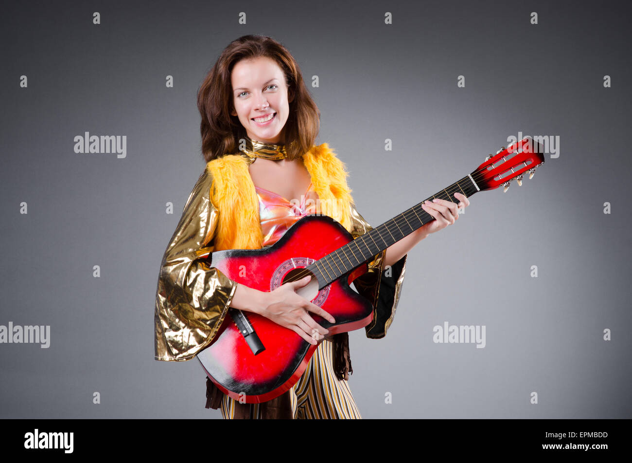 Guitar player with red instrument Stock Photo - Alamy