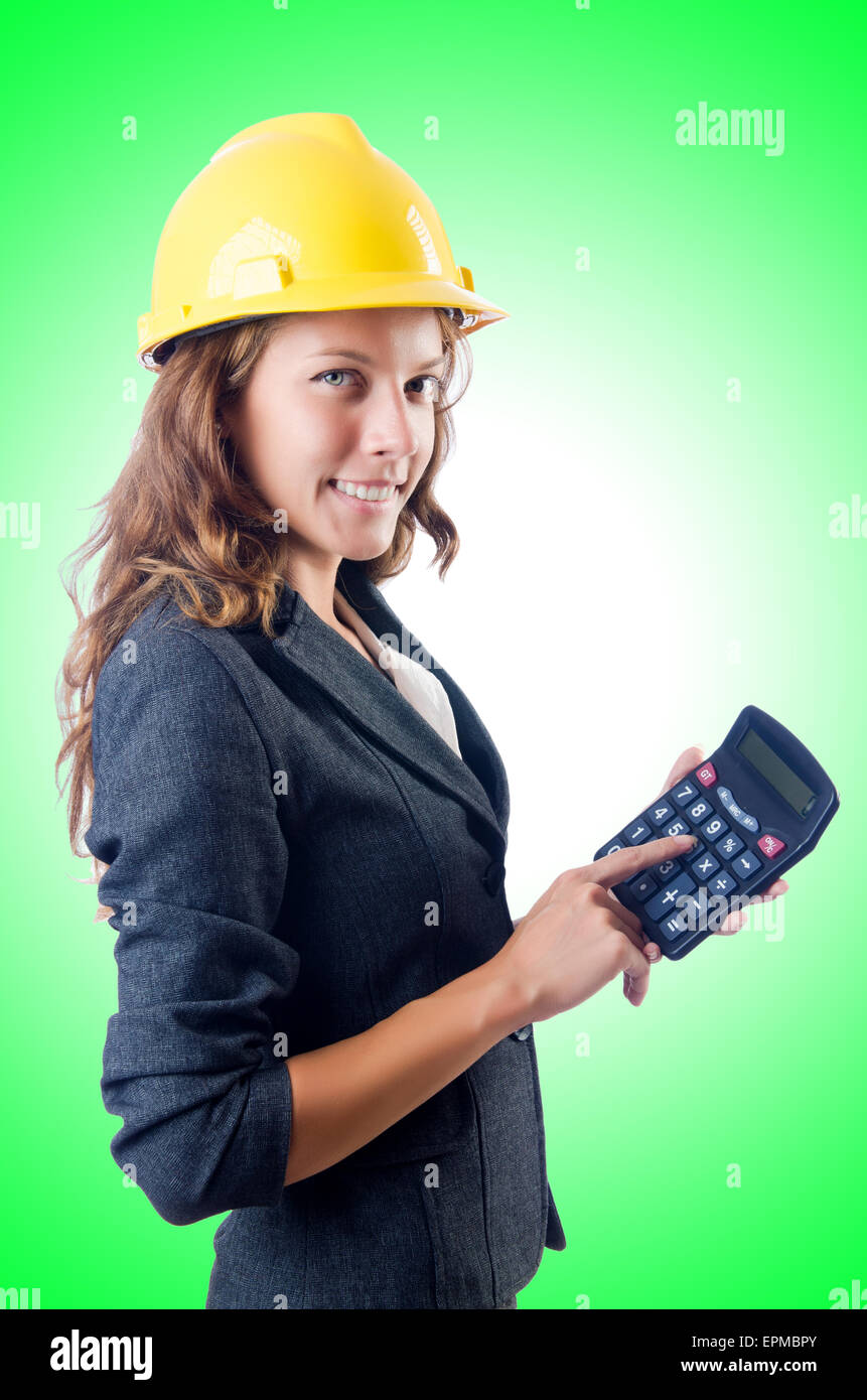 Female builder with calculator on white Stock Photo - Alamy