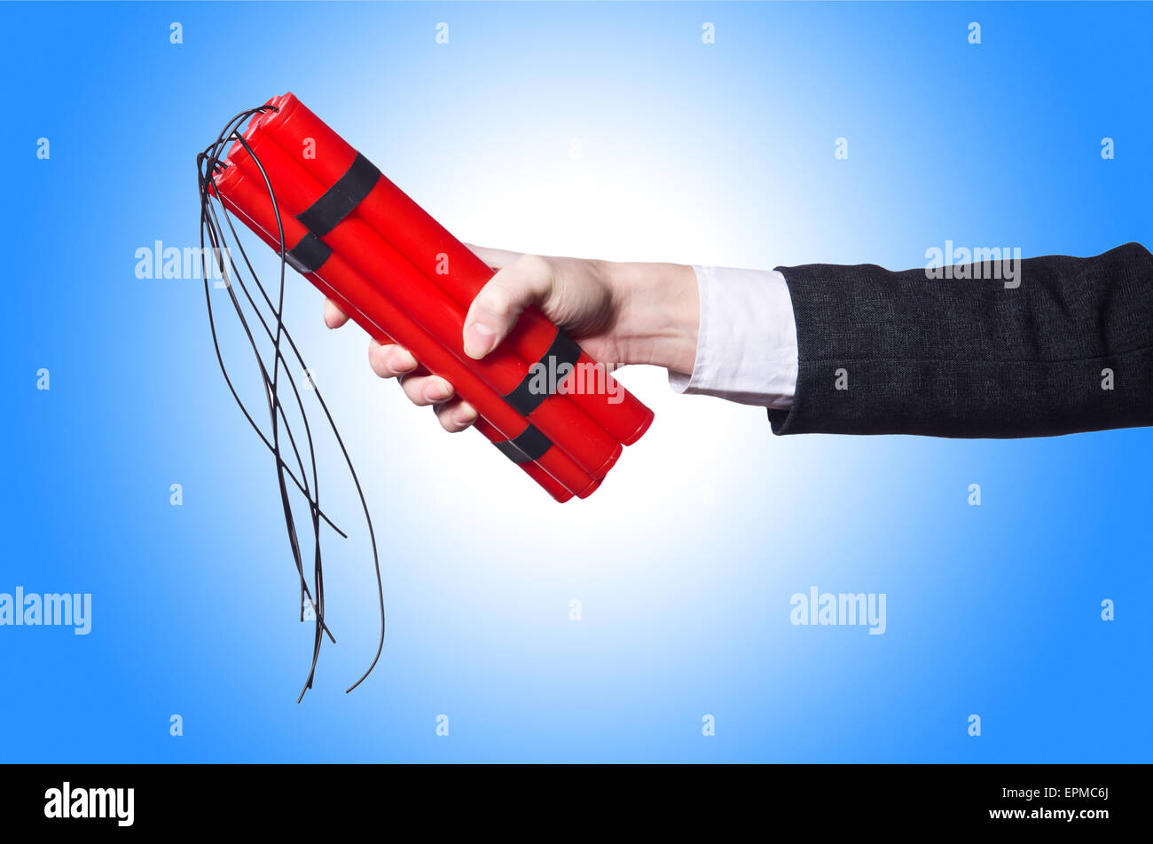 Hand holding bars of dynamite on white Stock Photo - Alamy