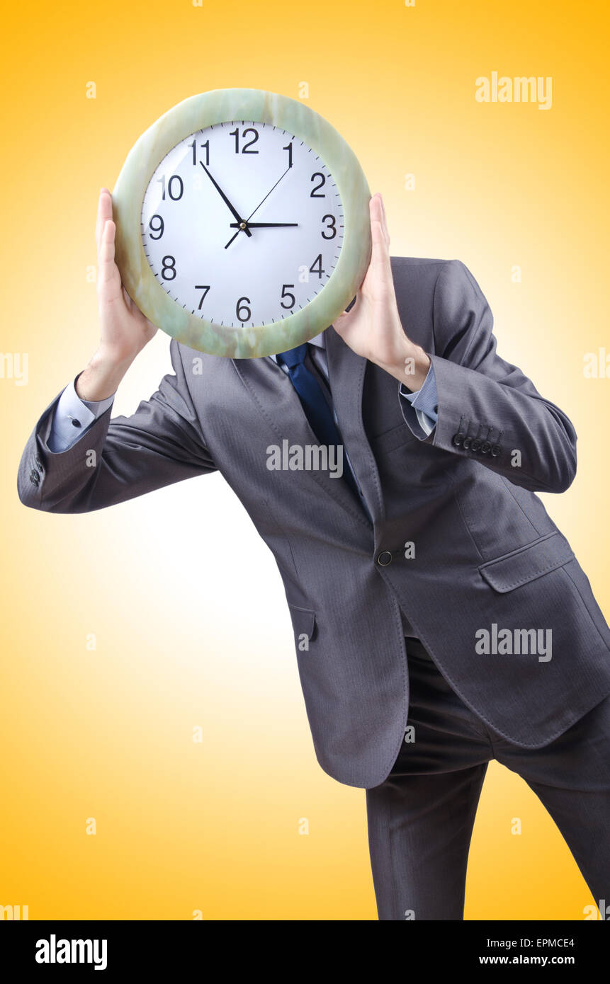 Man with clock isolated on white Stock Photo - Alamy