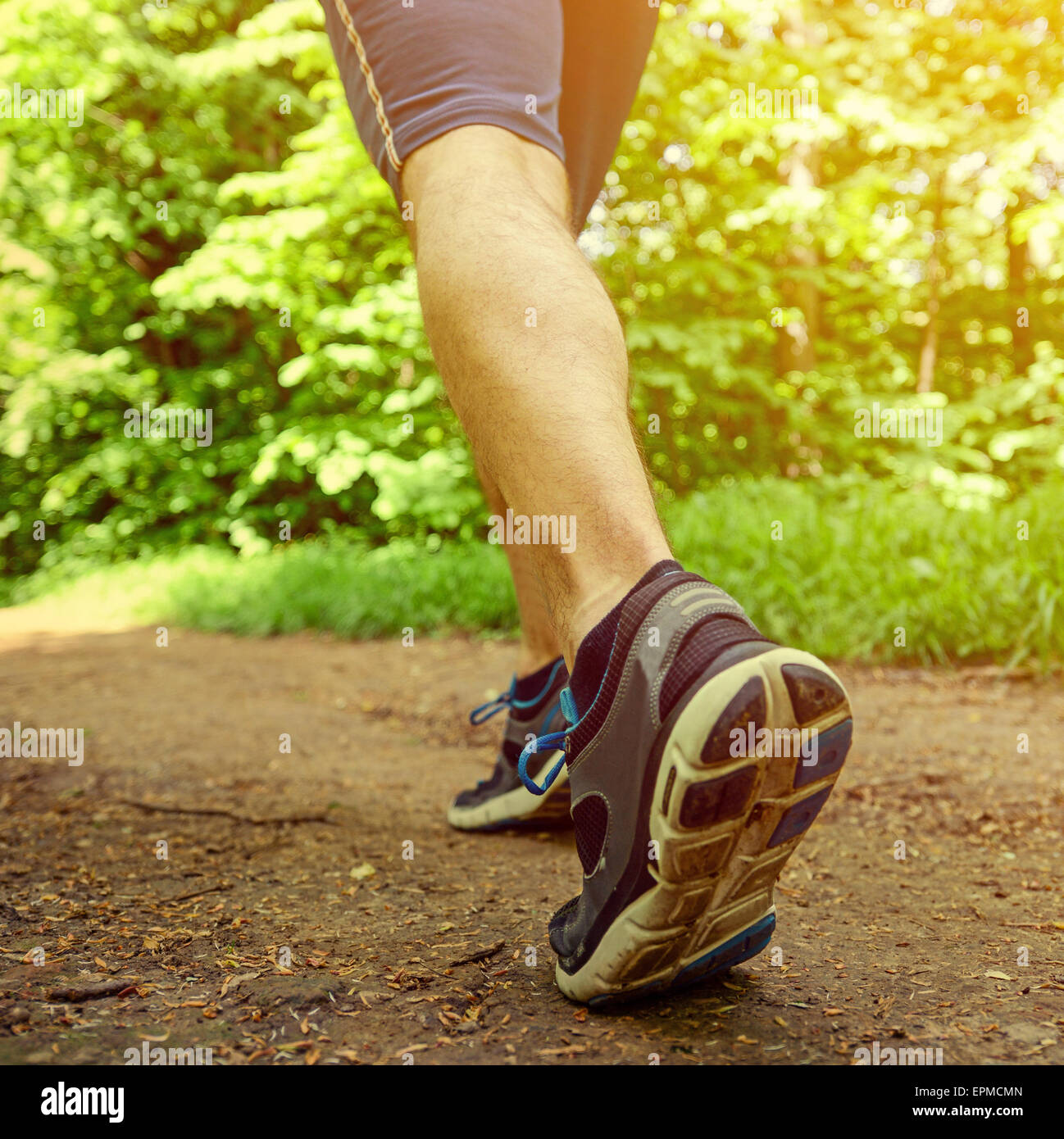 Runner feet running on road closeup on shoe Stock Photo - Alamy