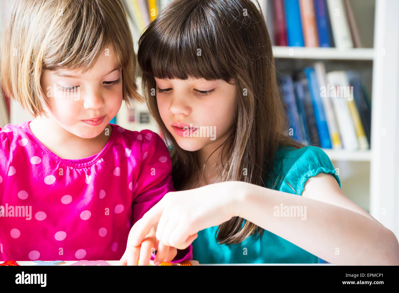 Portrait of two sisters playing together Stock Photo - Alamy