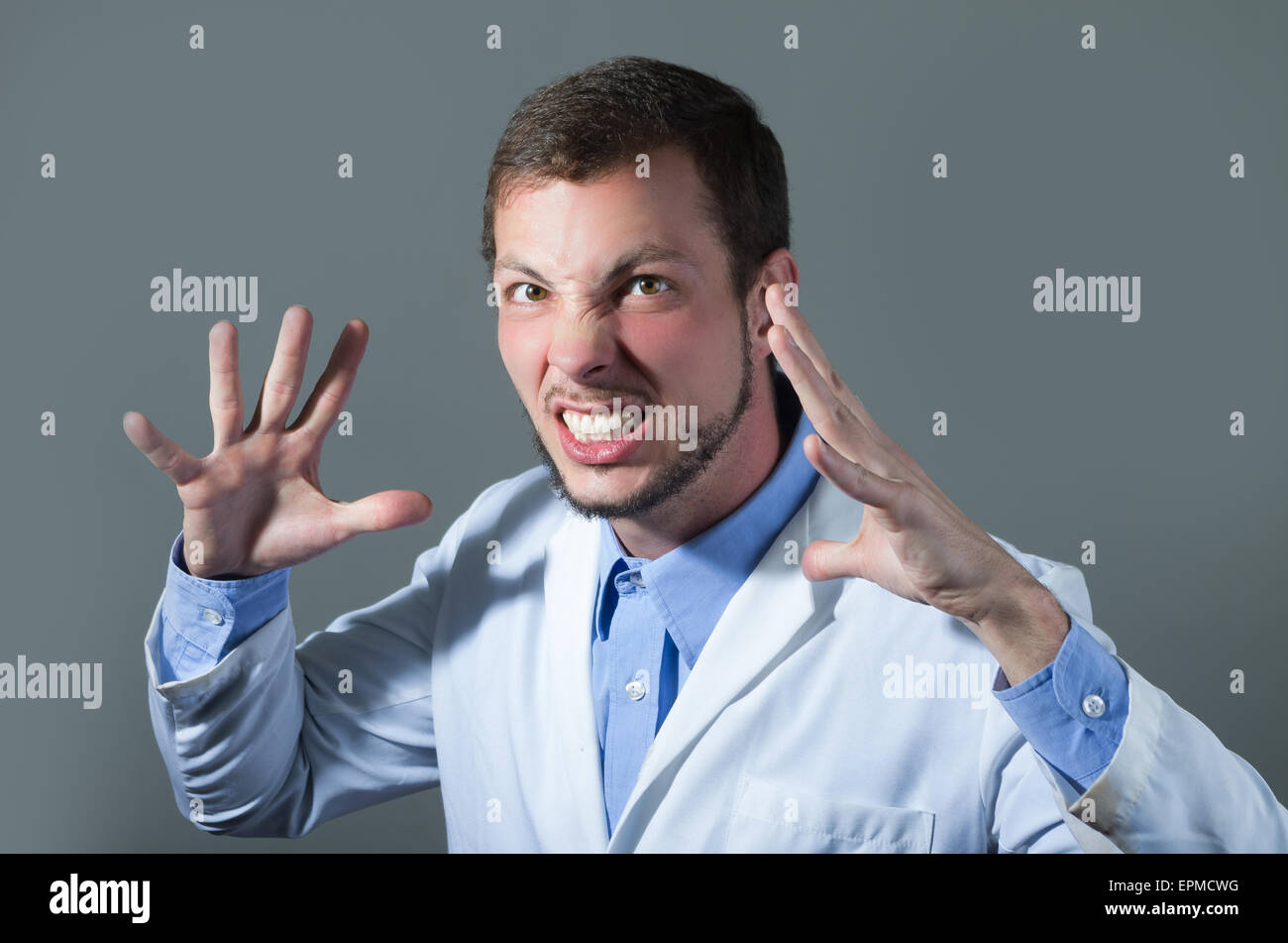 Closeup portrait of handsome angry young doctor Stock Photo - Alamy