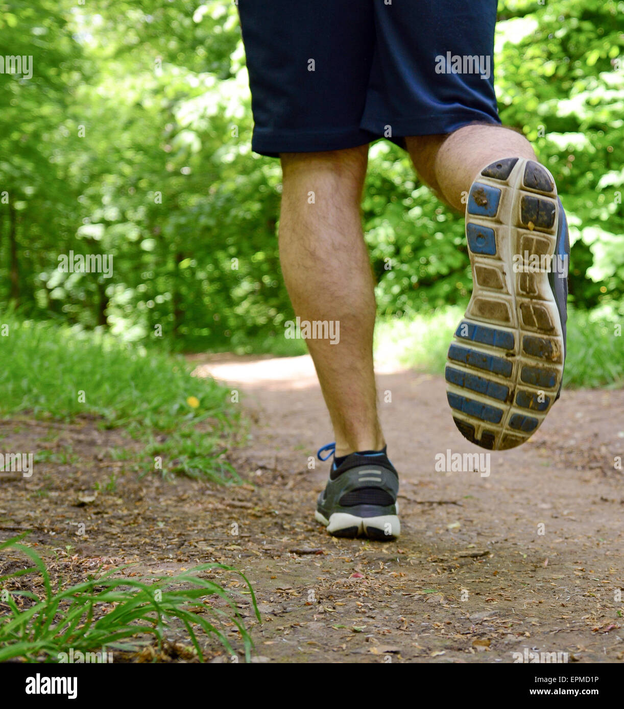 Runner feet running on road closeup on shoe Stock Photo - Alamy