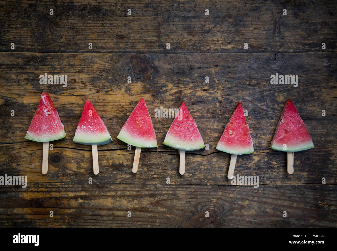 Row of six watermelon popsicles Stock Photo - Alamy