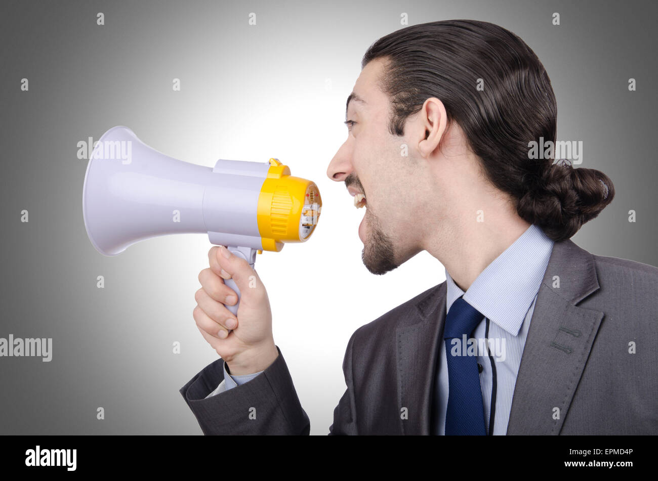 Man shouting and yelling with loudspeaker Stock Photo - Alamy