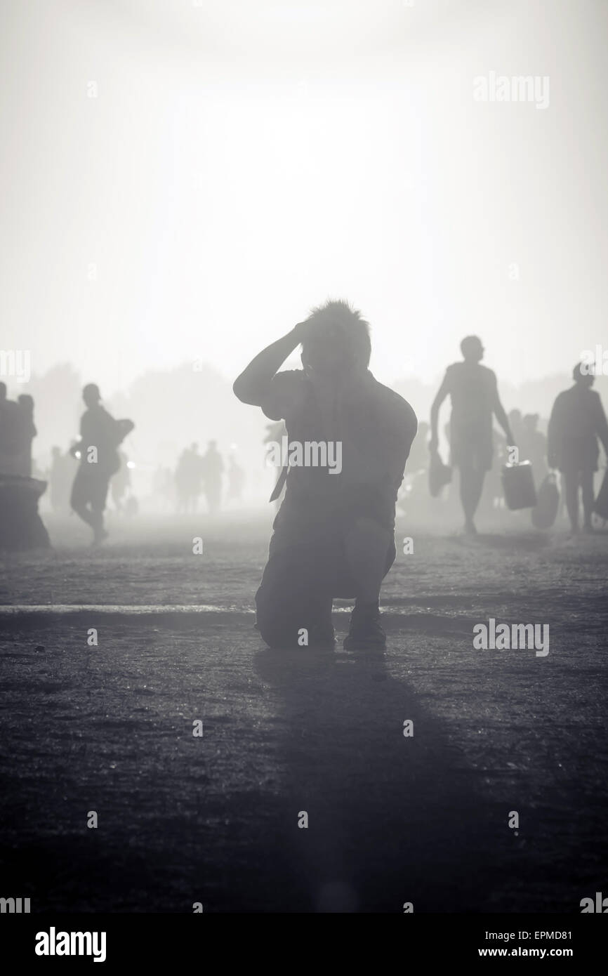 Lots of people in the dust Stock Photo - Alamy