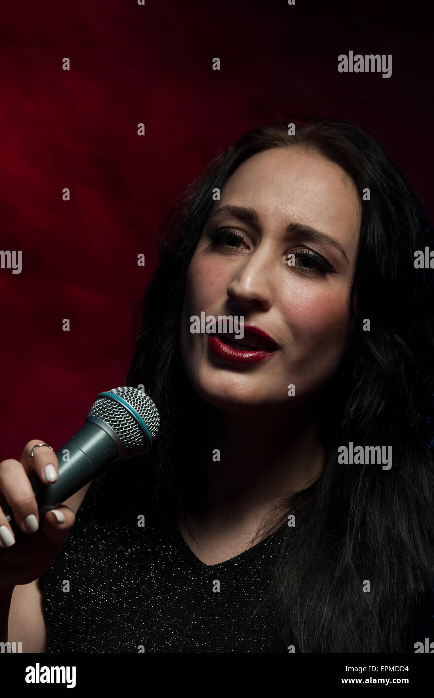 Beautiful woman singer performing hi-res stock photography and images ...