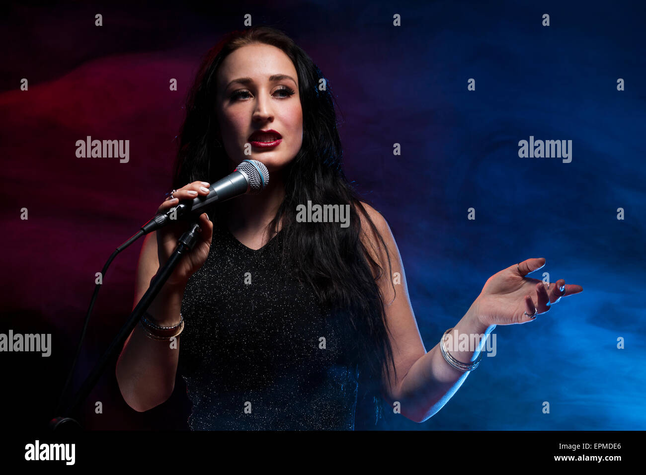 Beautiful female singer singing hi-res stock photography and images - Alamy