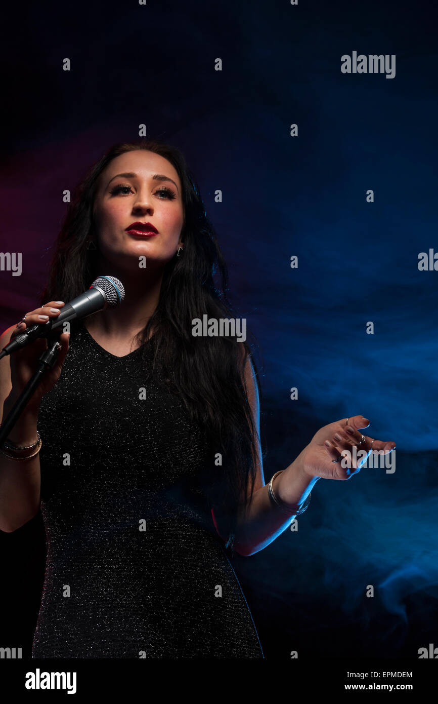 Beautiful female singer singing hi-res stock photography and images - Alamy