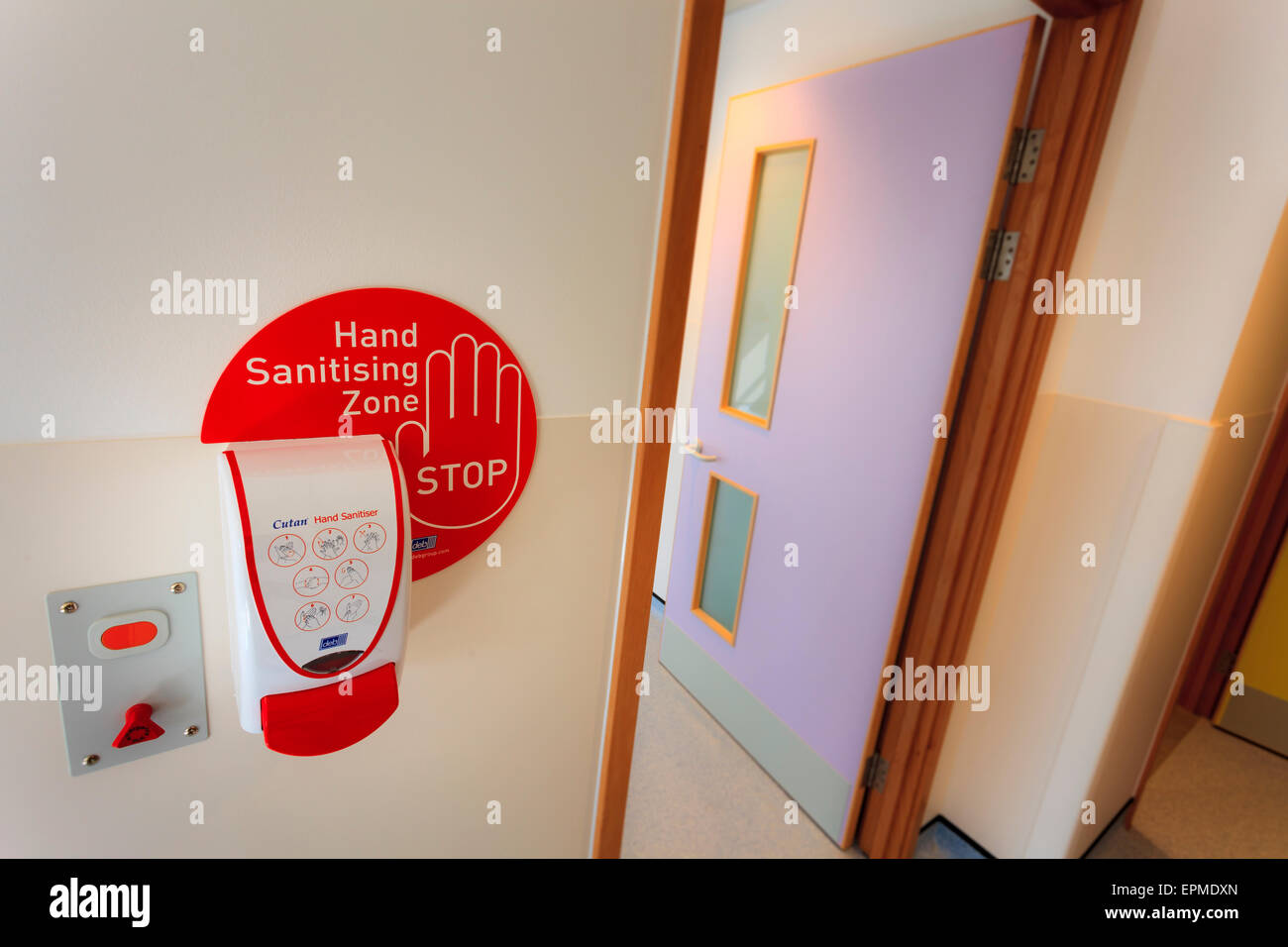 Hand sanitiser station by hospital doorway with hand sanitising zone ...
