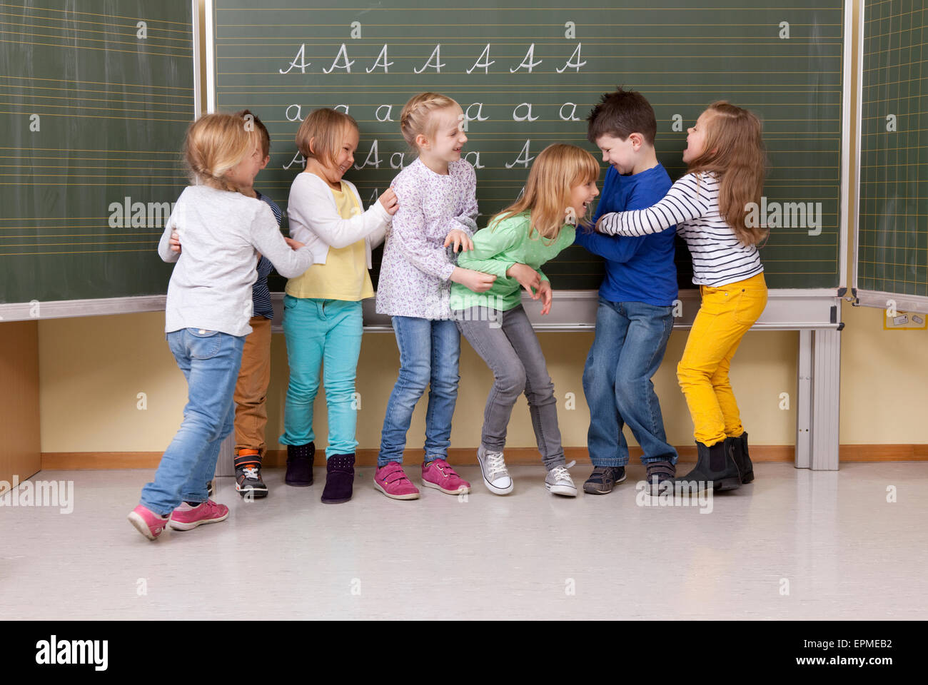 Playful pupils in classroom Stock Photo - Alamy