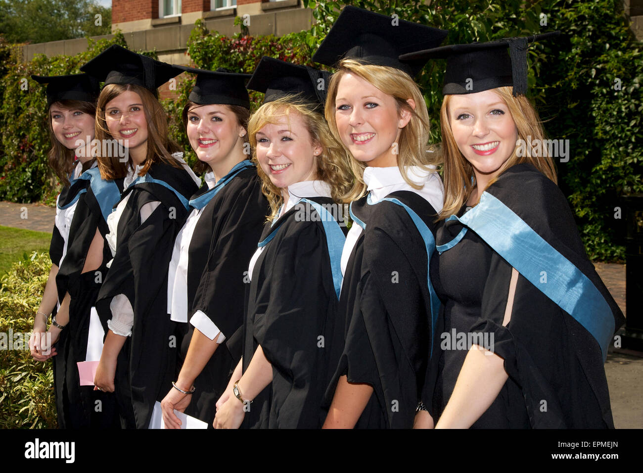 Girls with Degrees. A row of six new girl graduates at a degree ...