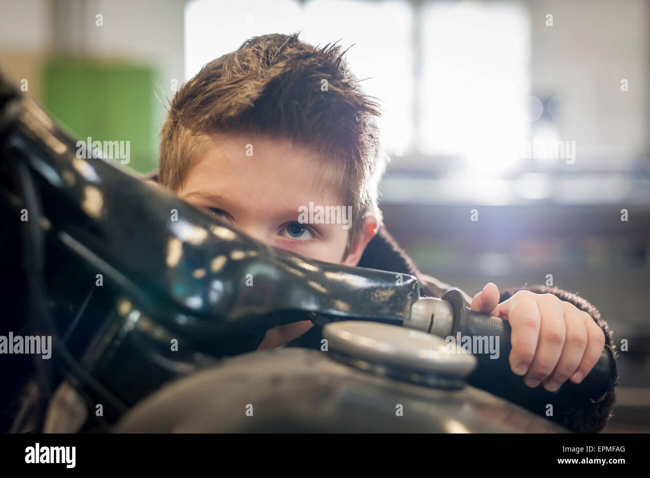 Boy playing with vintage moped Stock Photo - Alamy