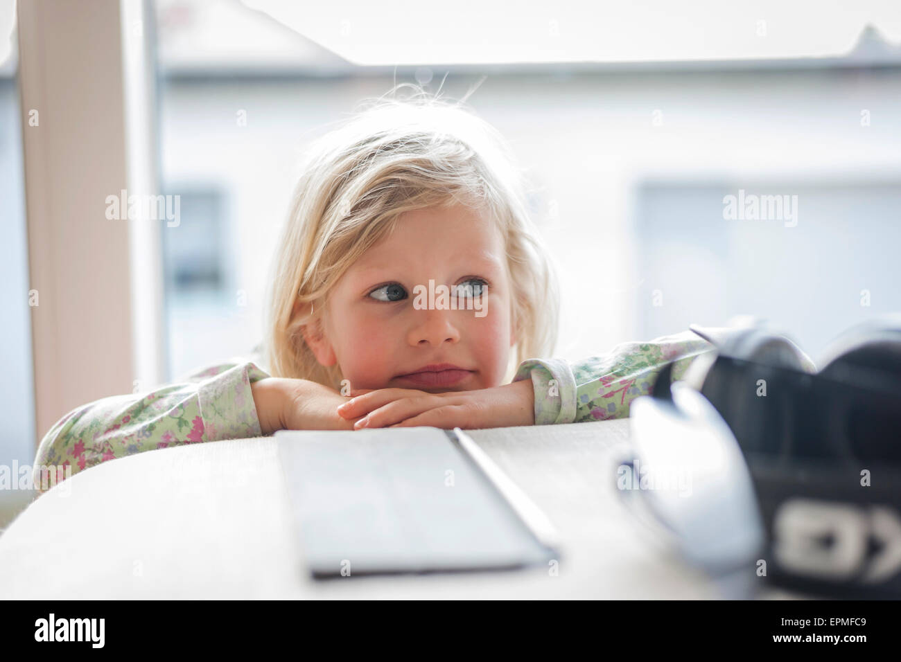 Little girl glancing sideways Stock Photo - Alamy