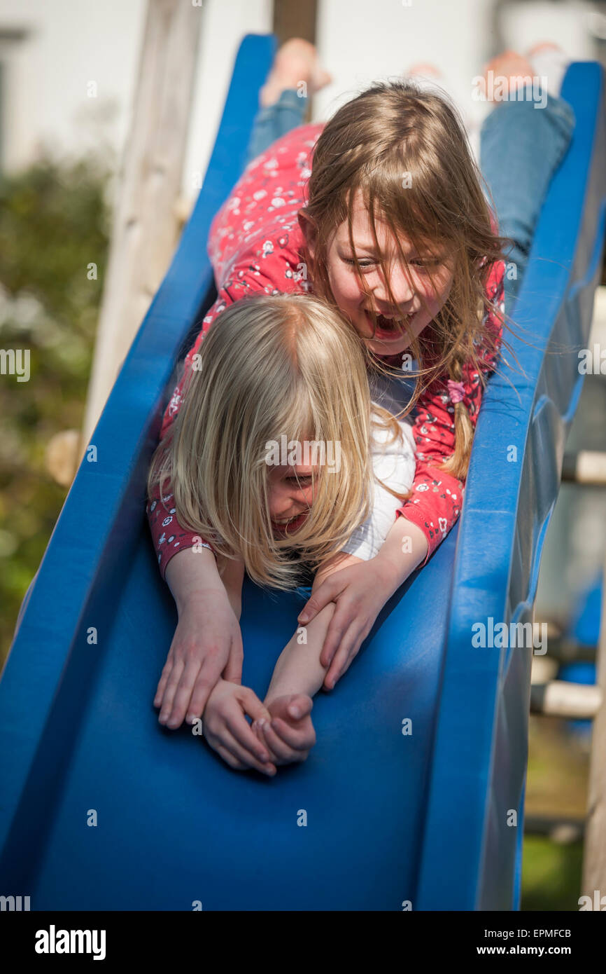 Girl head first slide hi-res stock photography and images - Alamy