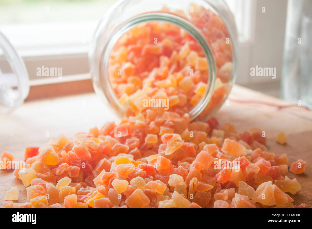 Dried papaya cubes, on a wooden cutting board Stock Photo - Alamy