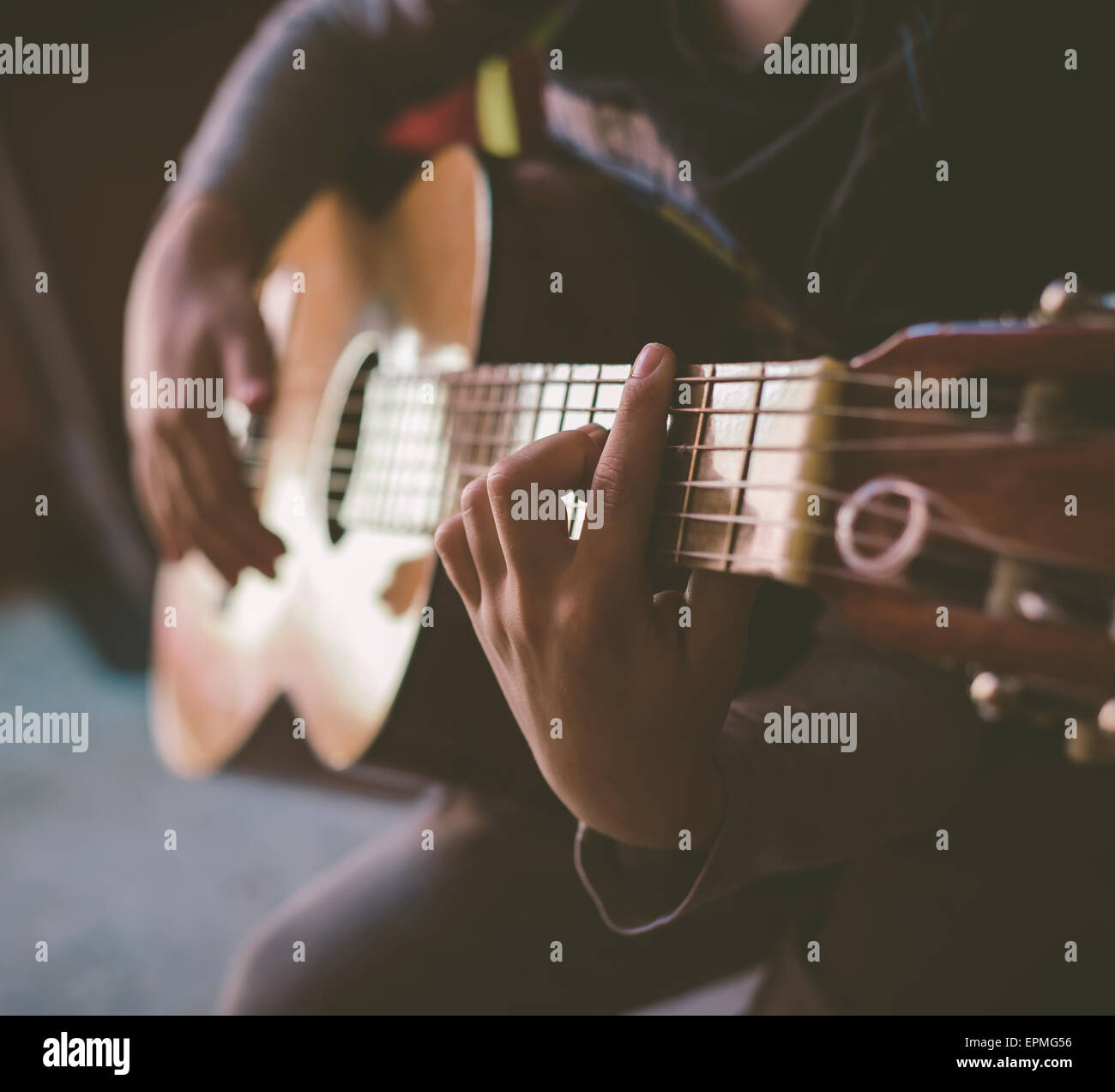 Little boy playing acoustic guitar at home, close-up Stock Photo - Alamy