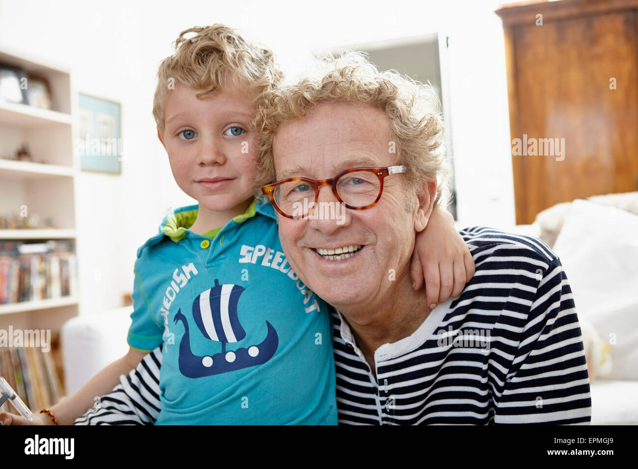 Grandfather and grandson playing at home Stock Photo - Alamy